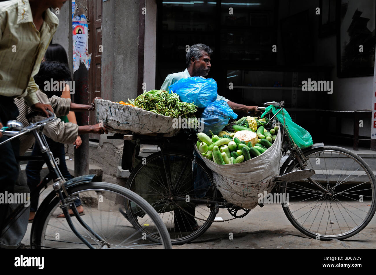 overloaded bicycle transport heavy load struggle fruit vegetables food ...