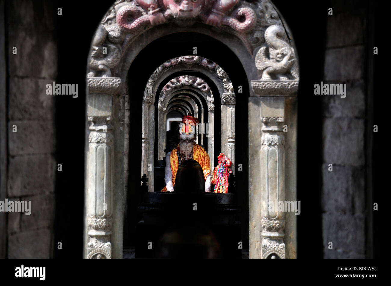 friendly Sadhu hindu hindi holy man viewed through Votive Shrines ...