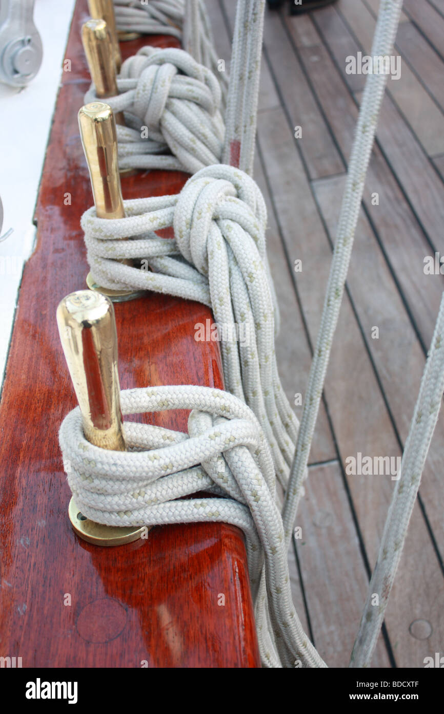 Ship ropes shiny brass and wood planks Stock Photo - Alamy
