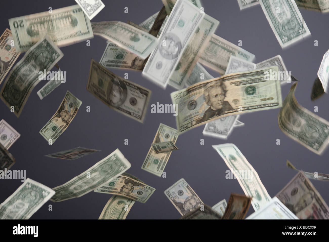 American currency falling Stock Photo - Alamy