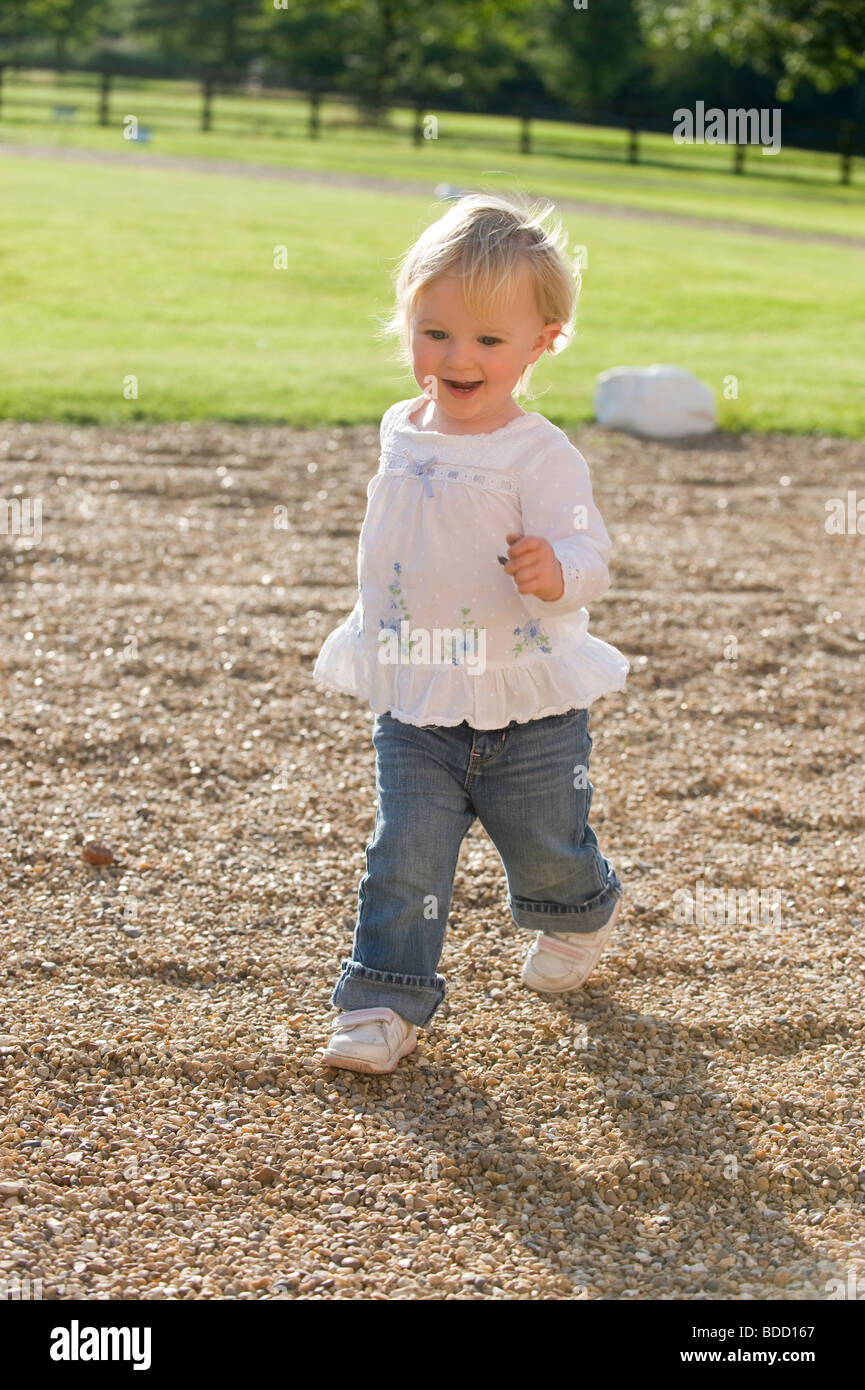 Baby girl 21 months old, on gravel path Stock Photo - Alamy