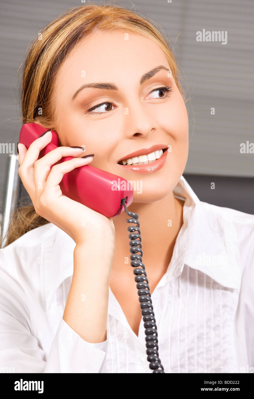 picture of lovely girl with phone in office Stock Photo - Alamy
