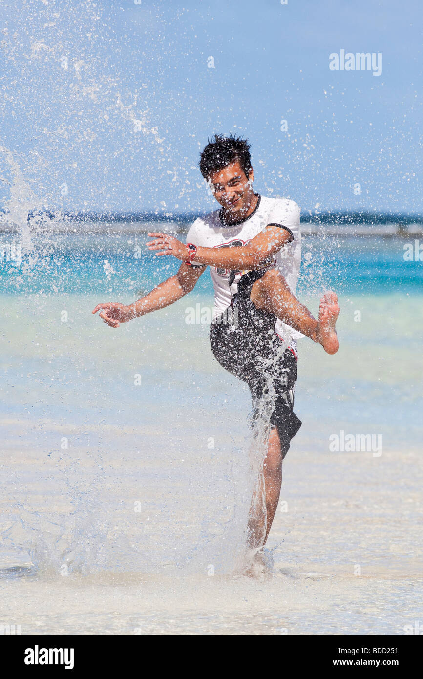 Man splashing blue water hi-res stock photography and images - Alamy