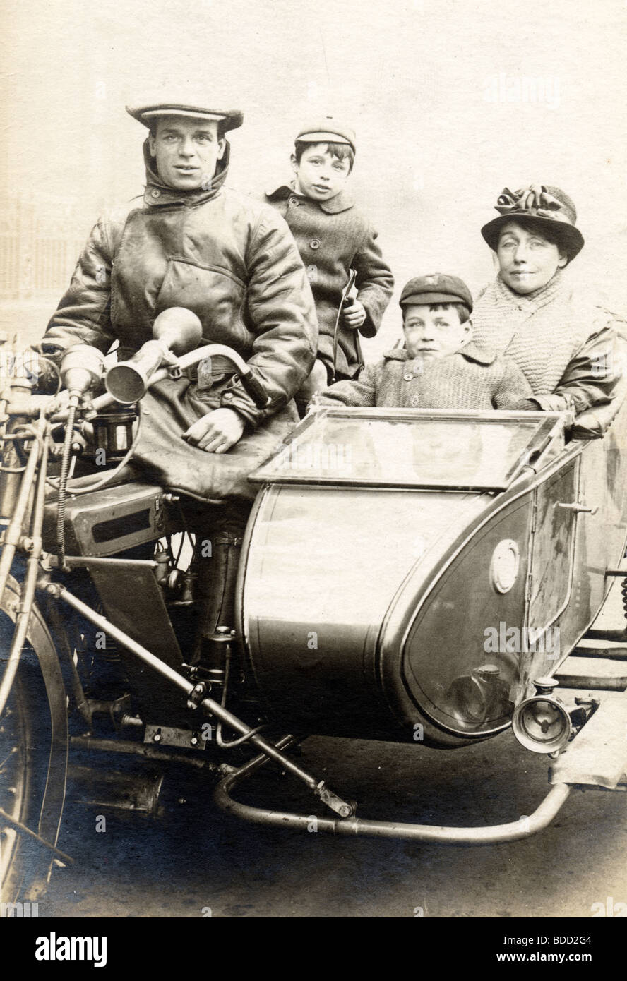 Mr. Coates & Family of Four Riding Motorcycle Stock Photo - Alamy