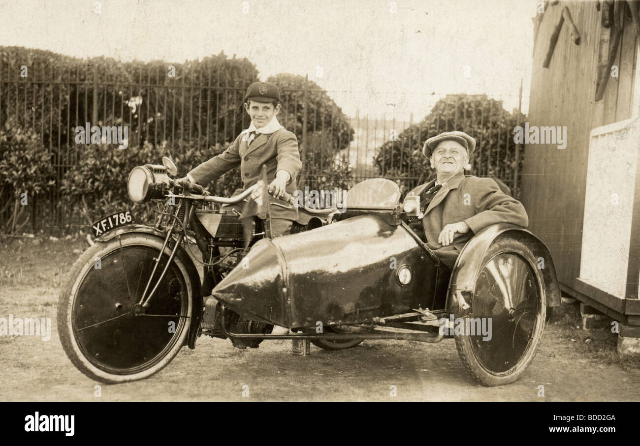 Grandson Driving Grandfather in Motorcycle Stock Photo - Alamy