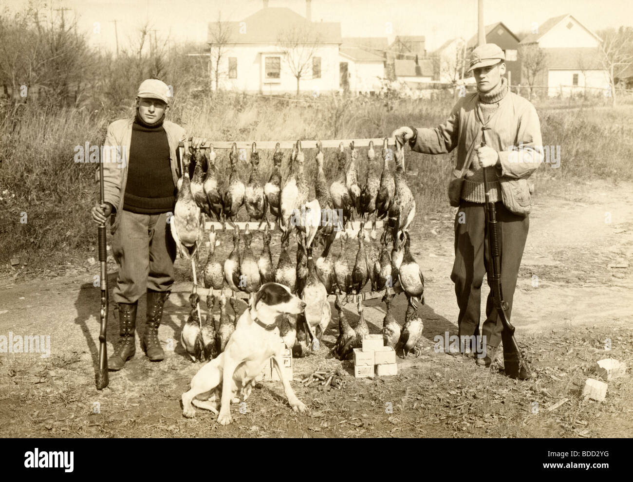 Two Hunters Displaying Ducks Stock Photo - Alamy