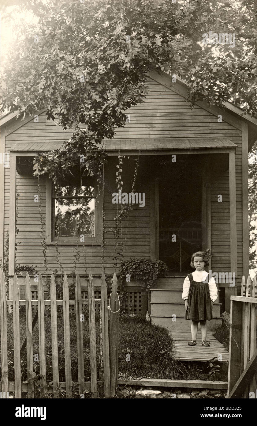 Little Girl in front of Her Cottage Stock Photo - Alamy
