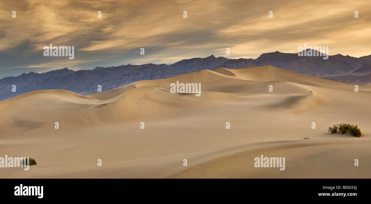 Photographer hiking in distance at Mesquite Flat dunes, Amargosa Range ...