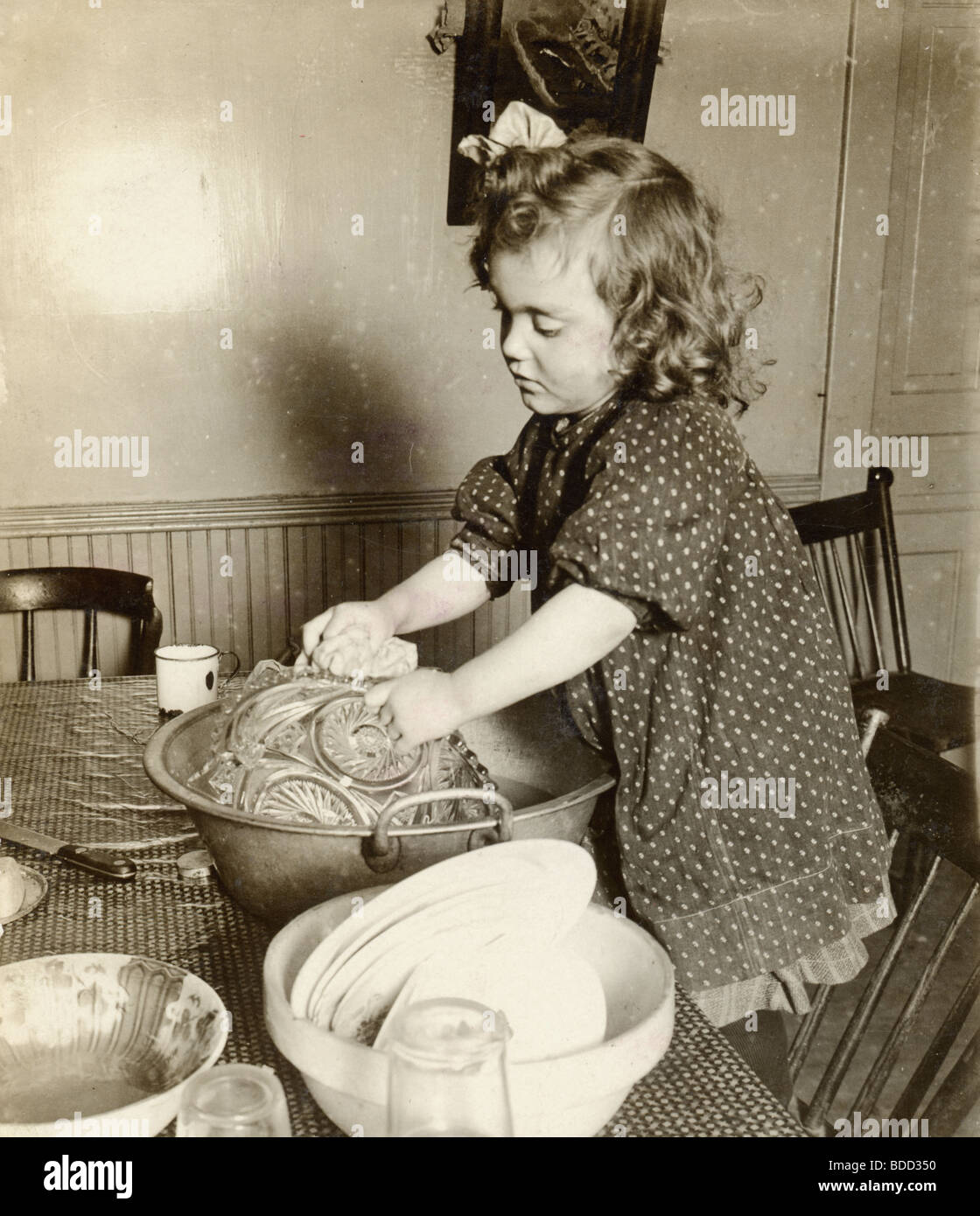 Cute Little Blond Girl Washing Dishes Stock Photo - Alamy
