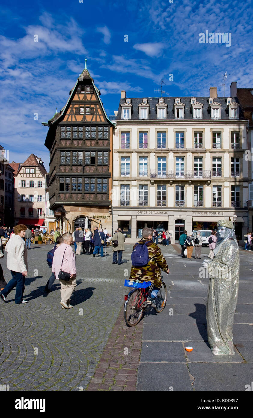 Busy cathedral square in Strasbourg with heritage Kammerzell house ...