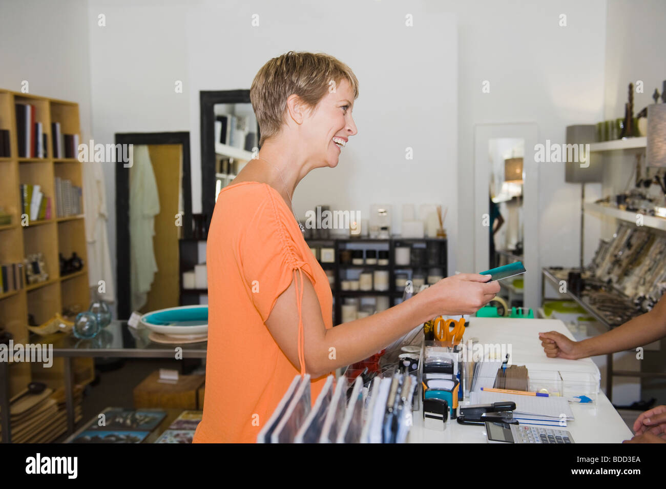Woman looking store clerk hi-res stock photography and images - Alamy