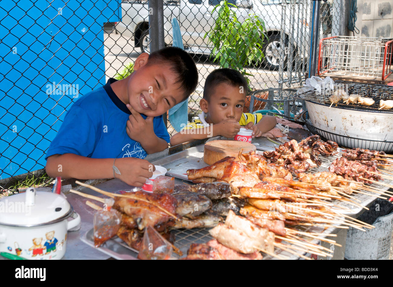 Happy thai children on street stall hi-res stock photography and images ...