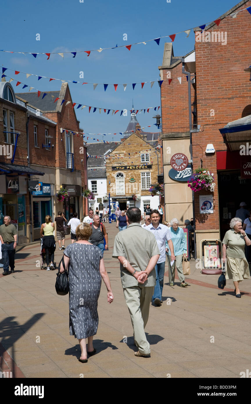 People walking through a pedestrianised zone in the pretty market town ...