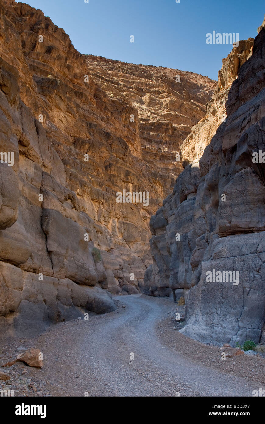 Car squeezing through the narrows of Titus Canyon in Grapevine ...
