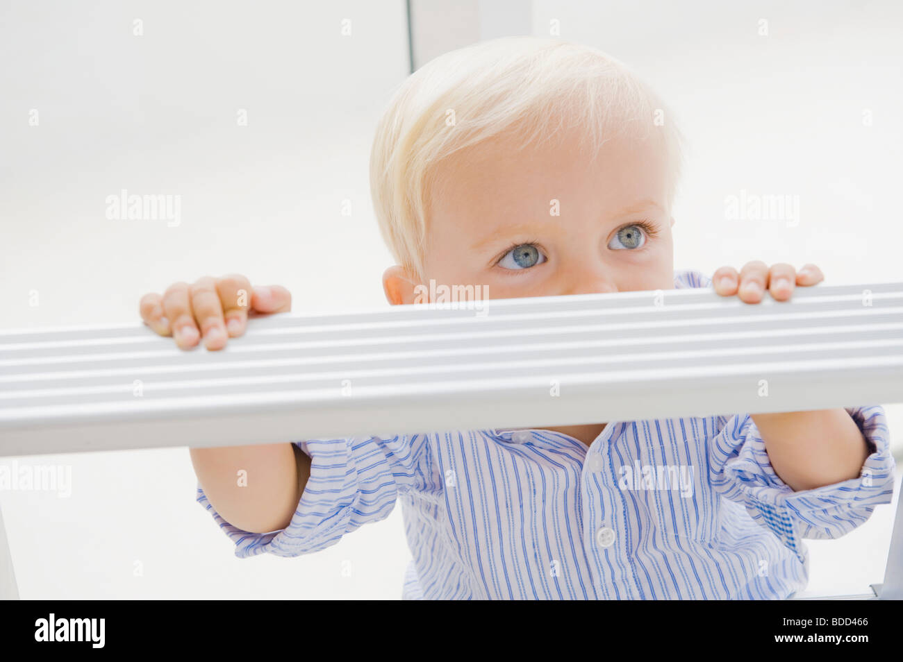 Baby boy with a step ladder Stock Photo - Alamy