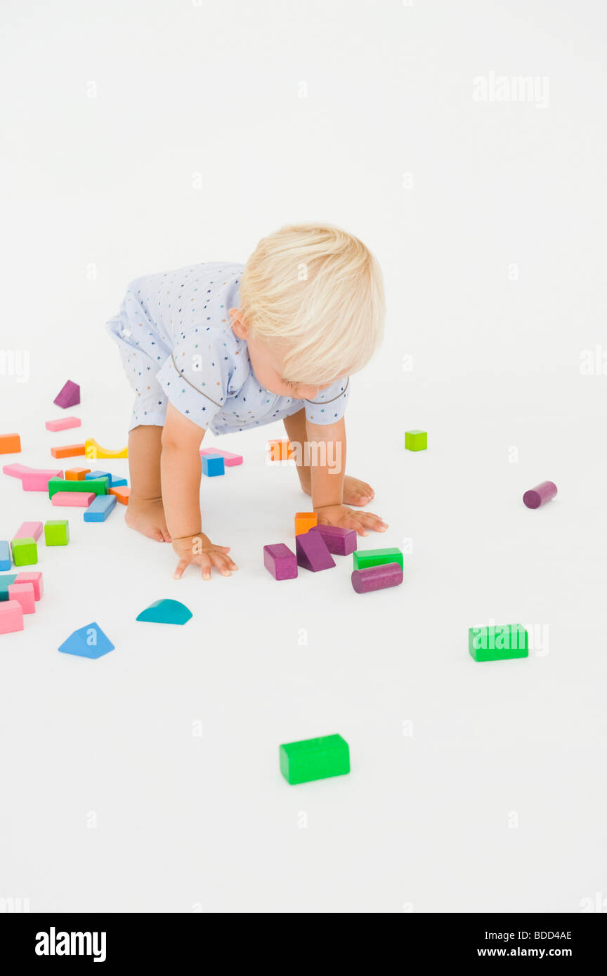 Baby boy playing with blocks Stock Photo - Alamy