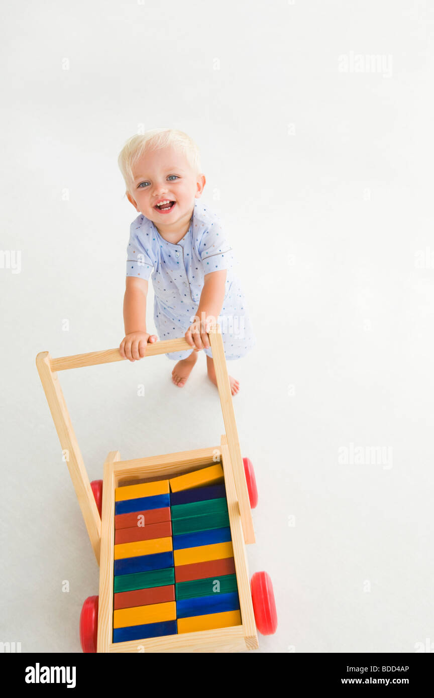 Cute baby boy push cart hi-res stock photography and images - Alamy