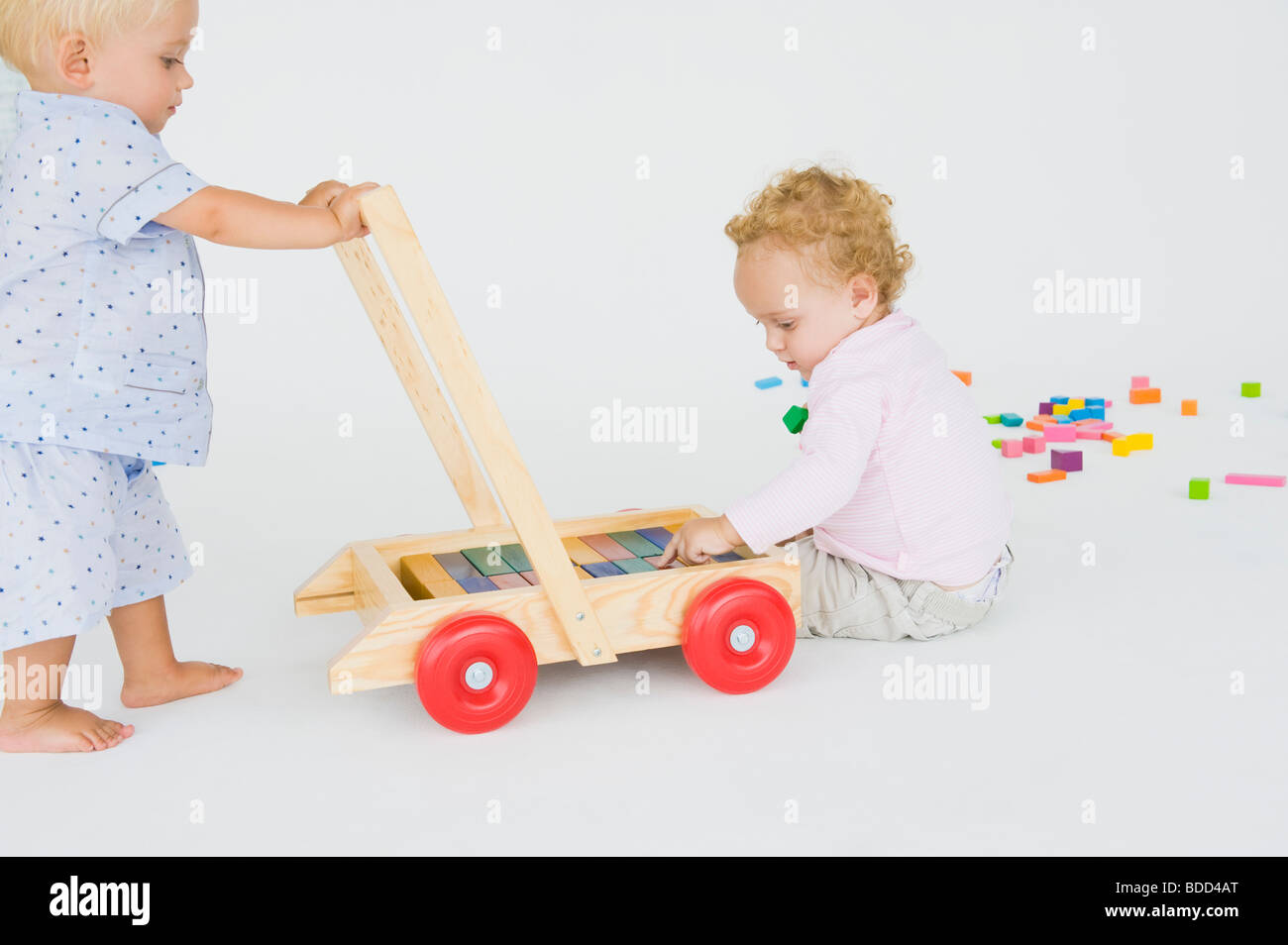 Boys pushing cart hi-res stock photography and images - Alamy