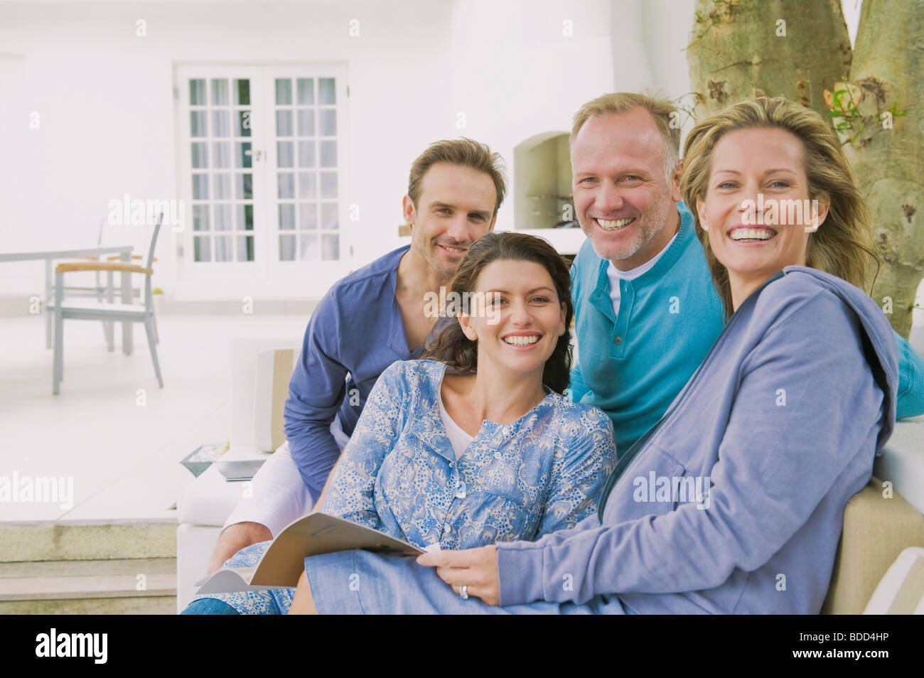 Portrait of two couples smiling Stock Photo - Alamy
