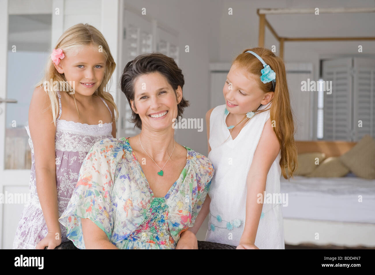 Woman smiling with her two daughters Stock Photo - Alamy