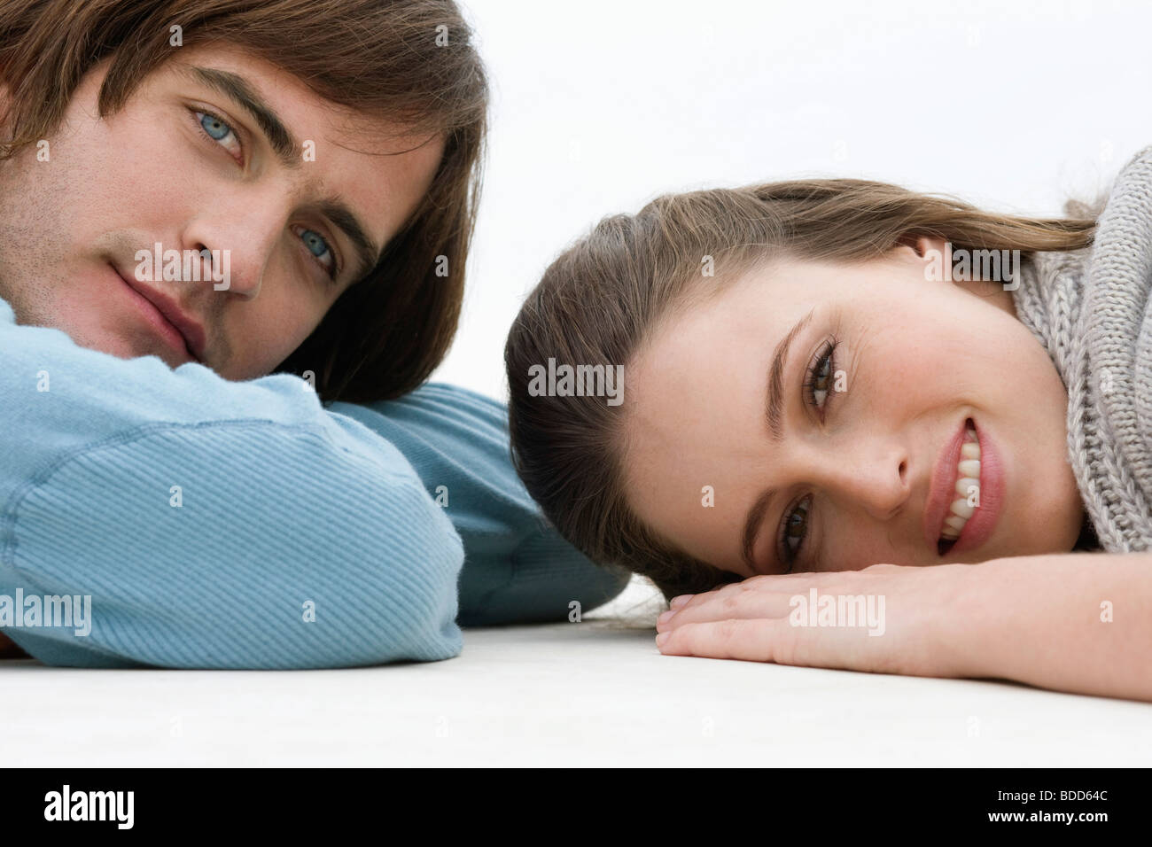 Couple lying on the floor Stock Photo - Alamy