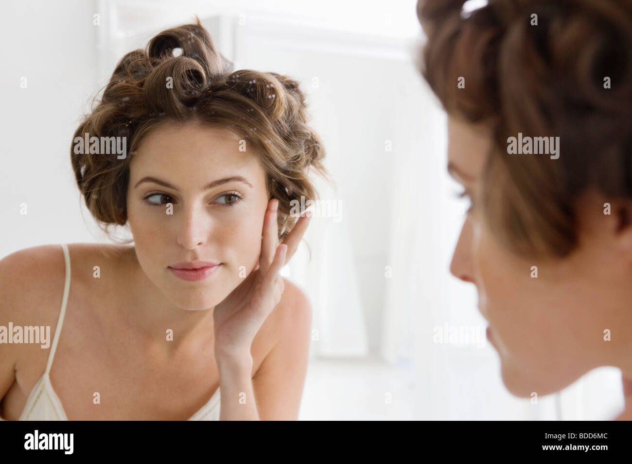 Woman checking body mirror hi-res stock photography and images - Alamy