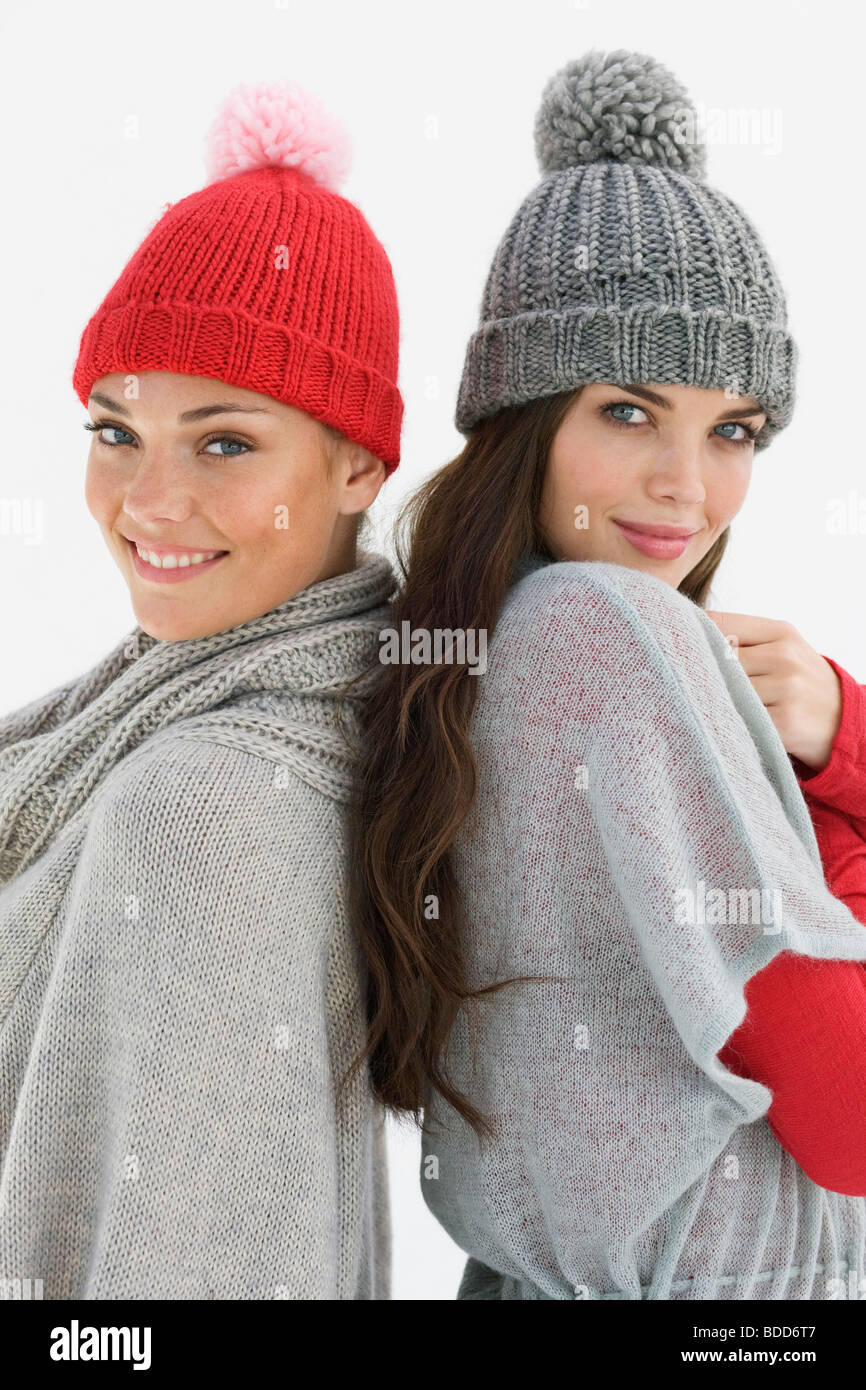 Portrait of two women standing back to back Stock Photo - Alamy
