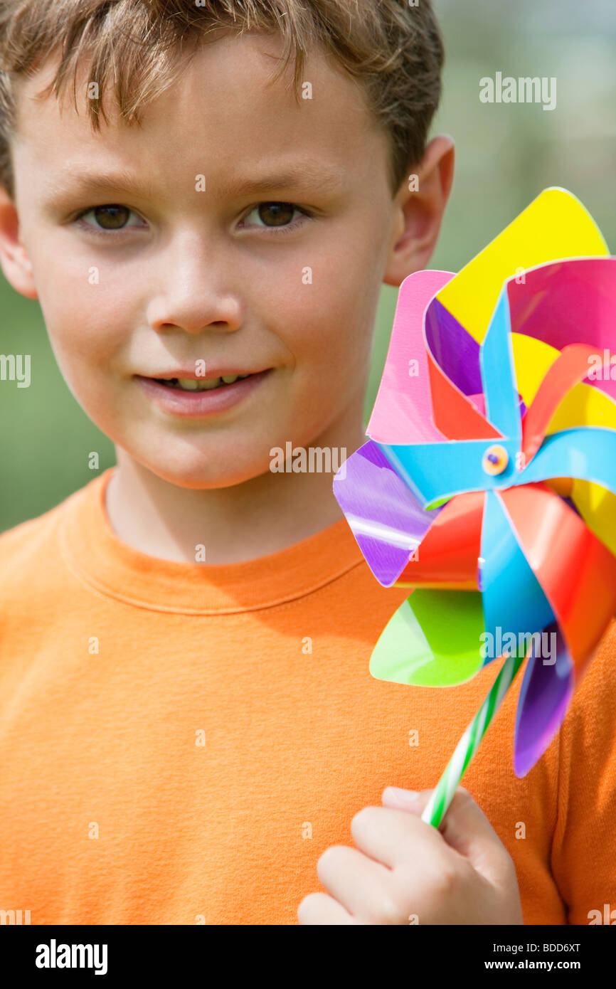 Boy holding a pinwheel Stock Photo - Alamy