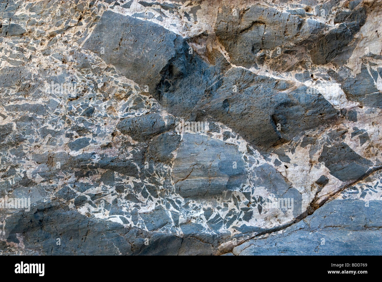 Limestone breccia rock patterns on walls in the narrows of Titus Canyon ...