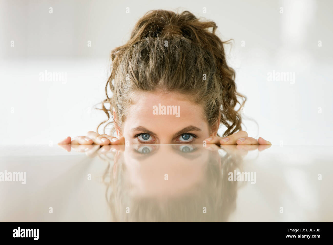 Hand over eyes peeking woman hi-res stock photography and images - Alamy