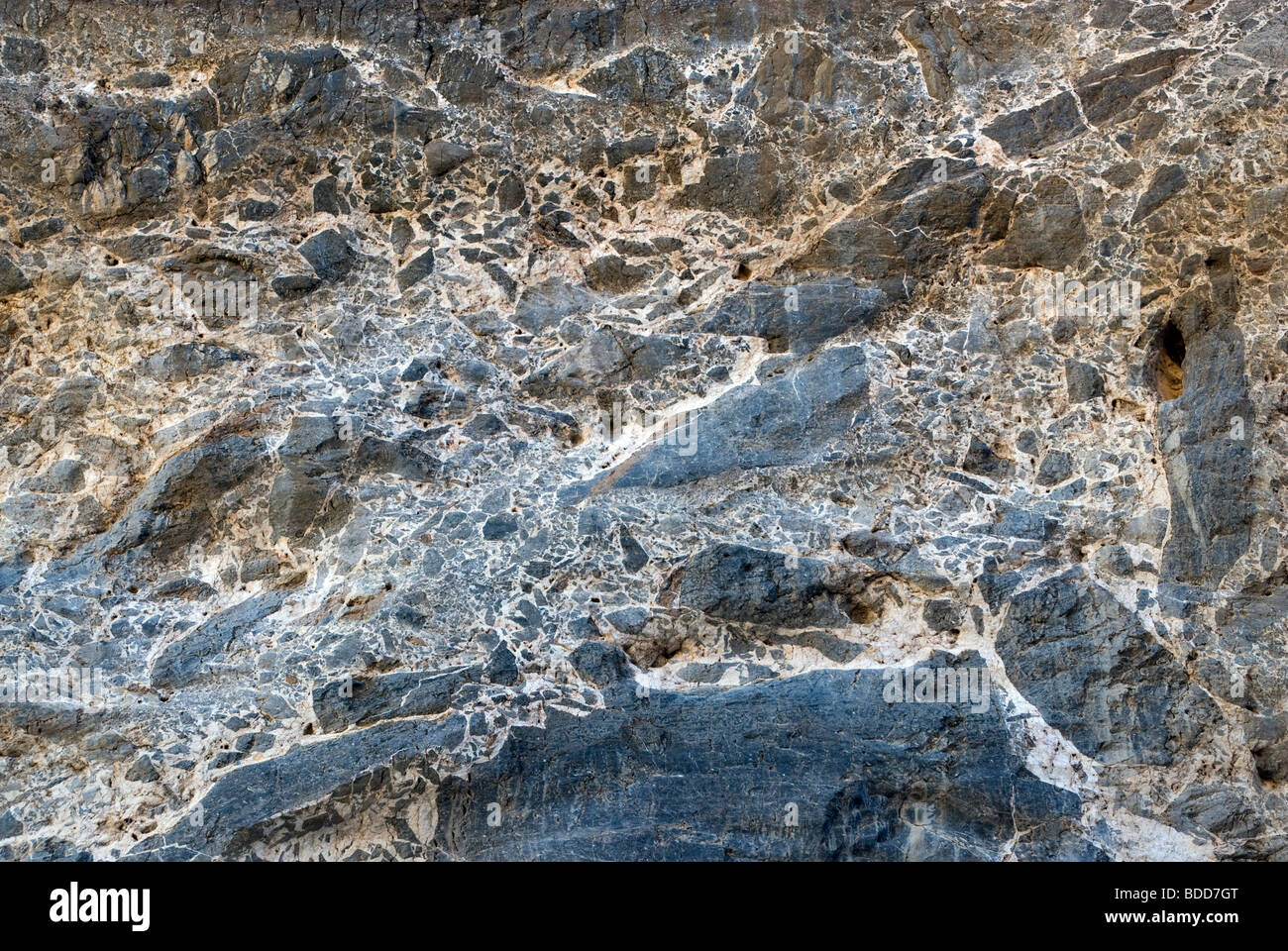 Limestone breccia rock patterns on walls in the narrows of Titus Canyon ...
