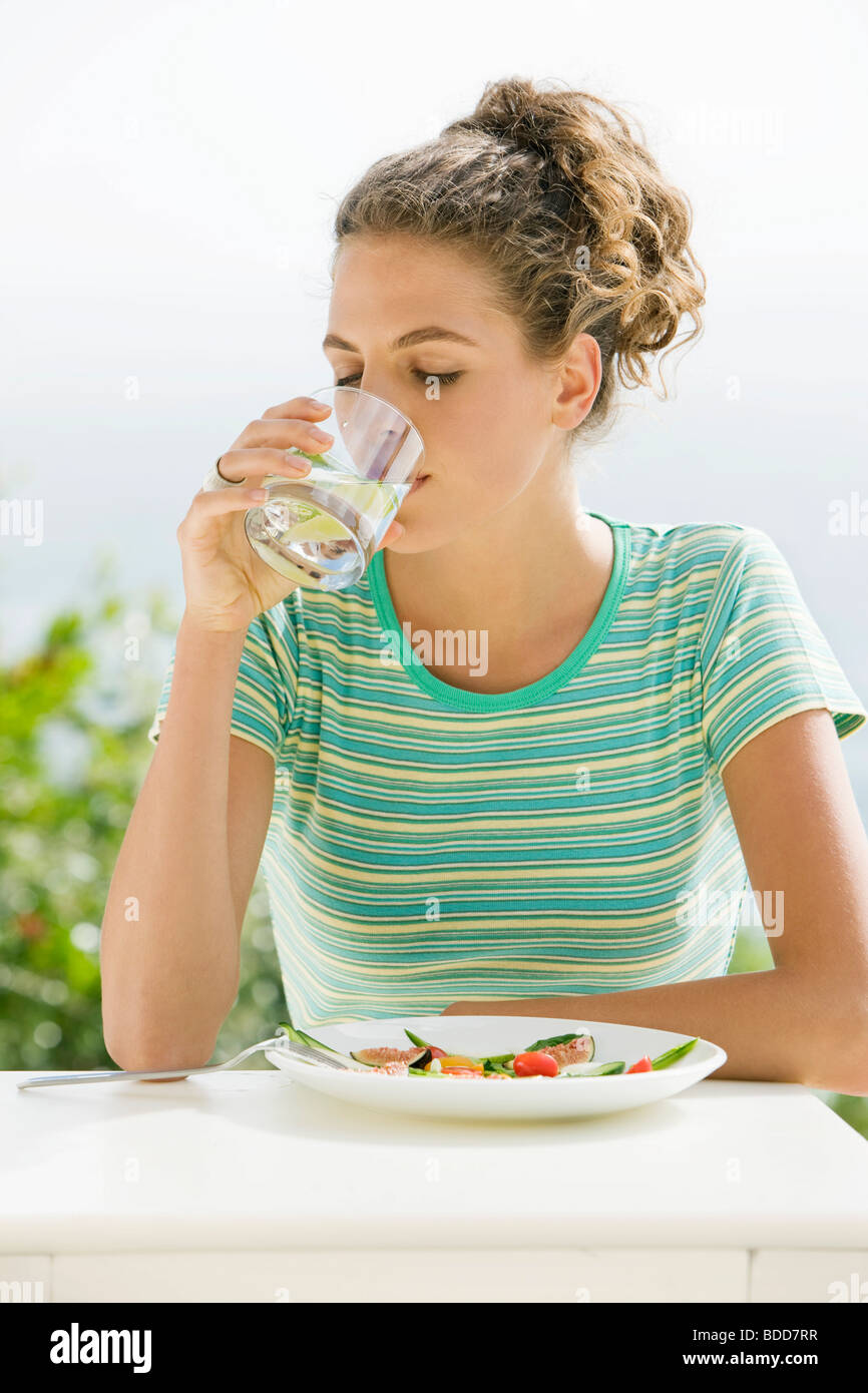 Woman drinking lemonade Stock Photo - Alamy