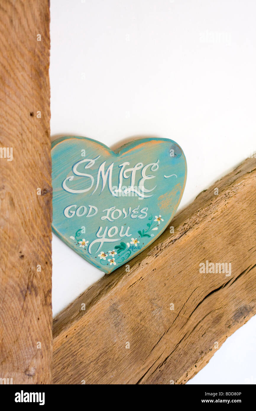 Smile God Loves You Painted on Wooden Heart Stock Photo - Alamy