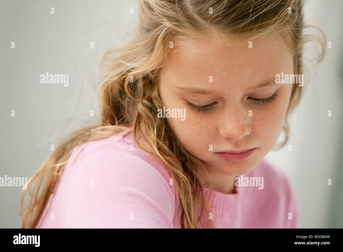 Close-up of a girl thinking Stock Photo - Alamy