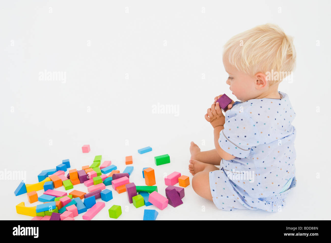 Baby boy playing with blocks Stock Photo - Alamy