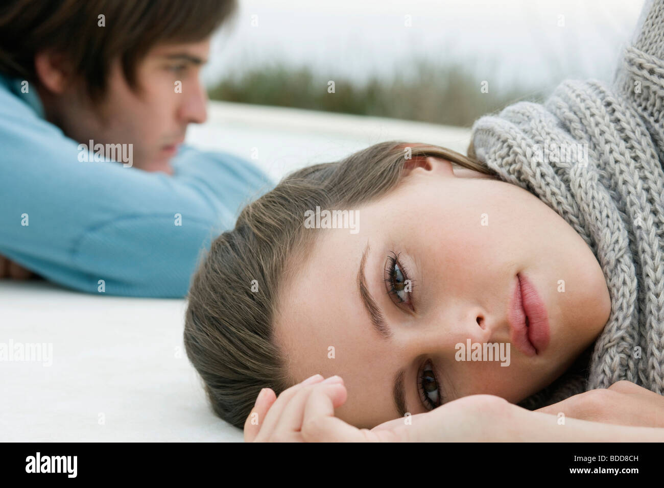 Couple lying on the floor Stock Photo - Alamy