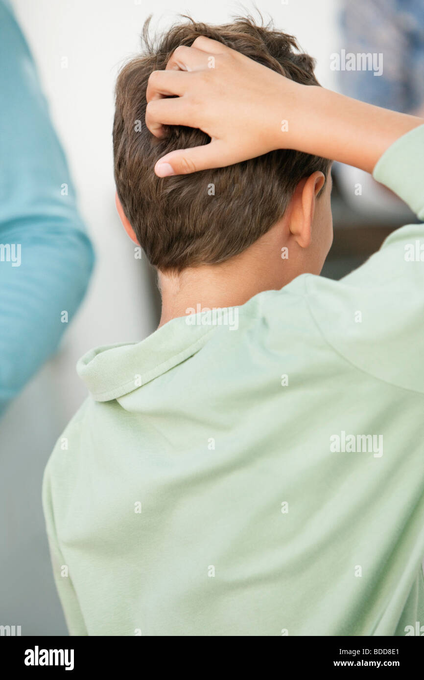 Boy scratching hi-res stock photography and images - Alamy