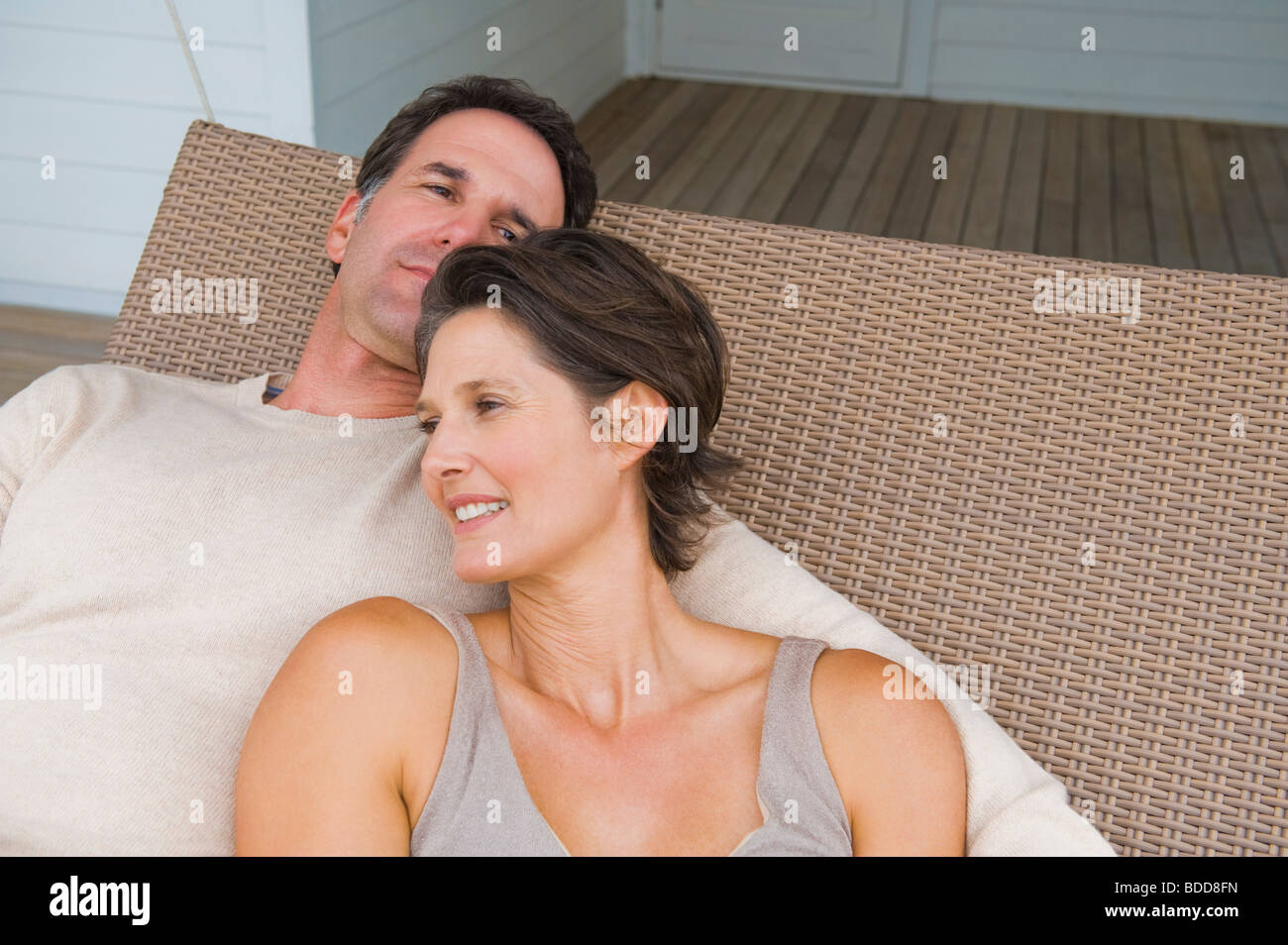 Couple resting on a porch swing Stock Photo - Alamy