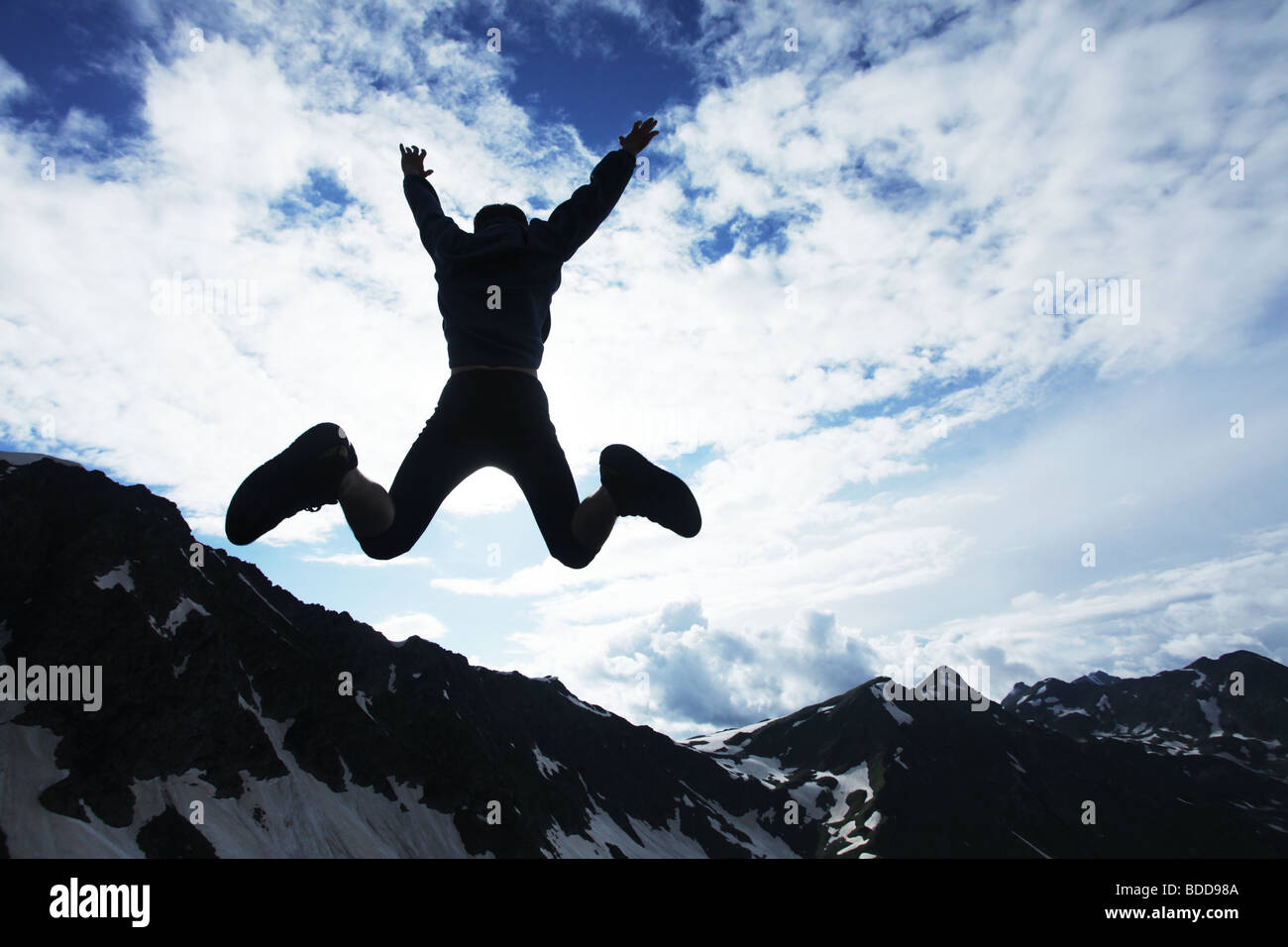 Silhouette boy jumping joy hi-res stock photography and images - Alamy