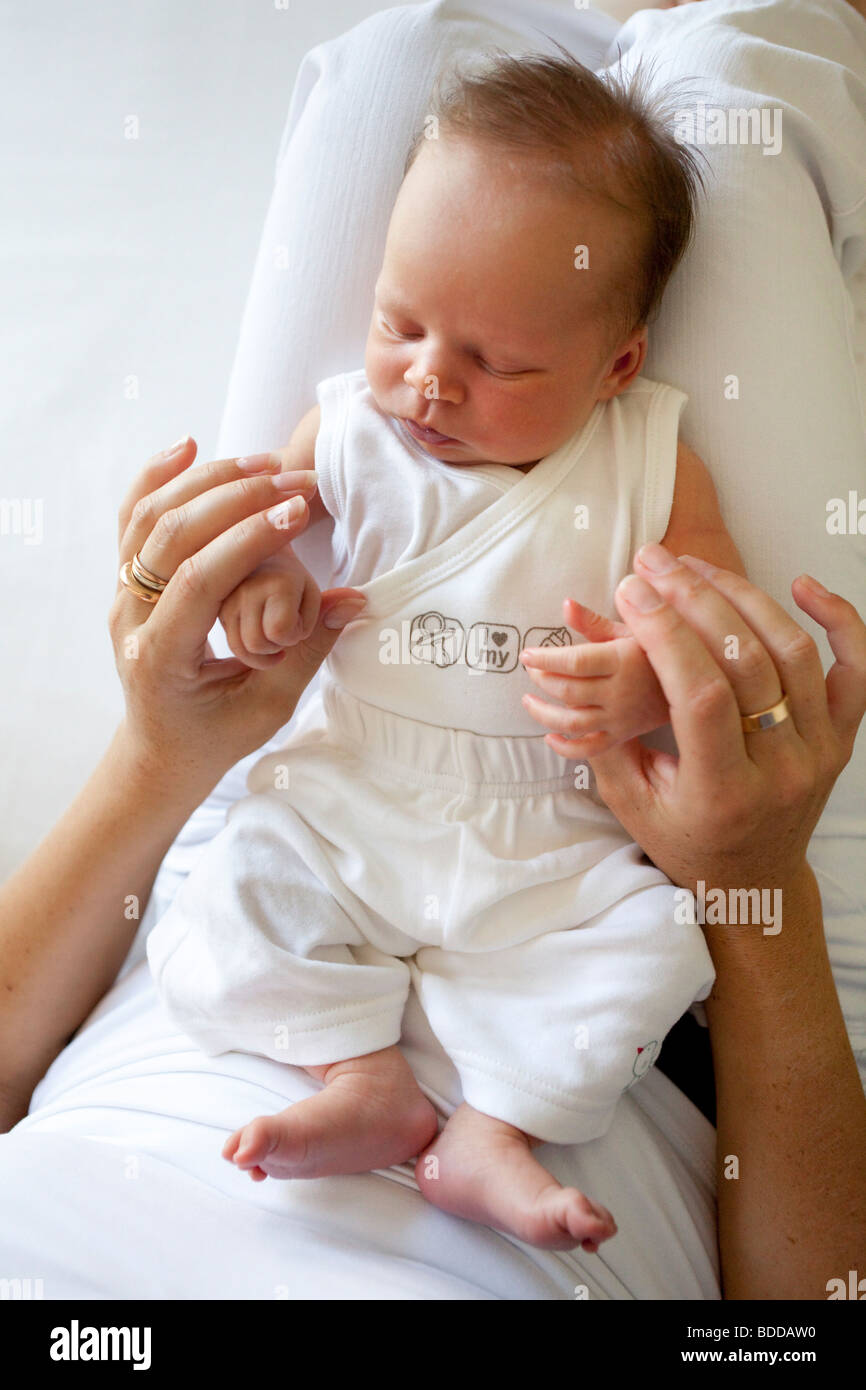 Baby sit on mother lap hi-res stock photography and images - Alamy