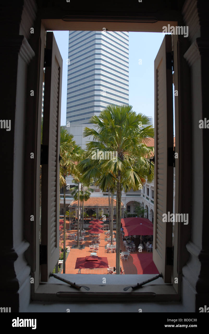 looking out of a second story window to Raffles Courtyard Restaurant ...