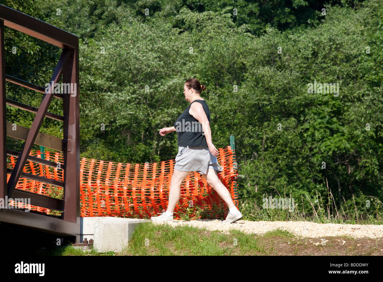 Overweight woman walking hi-res stock photography and images - Alamy