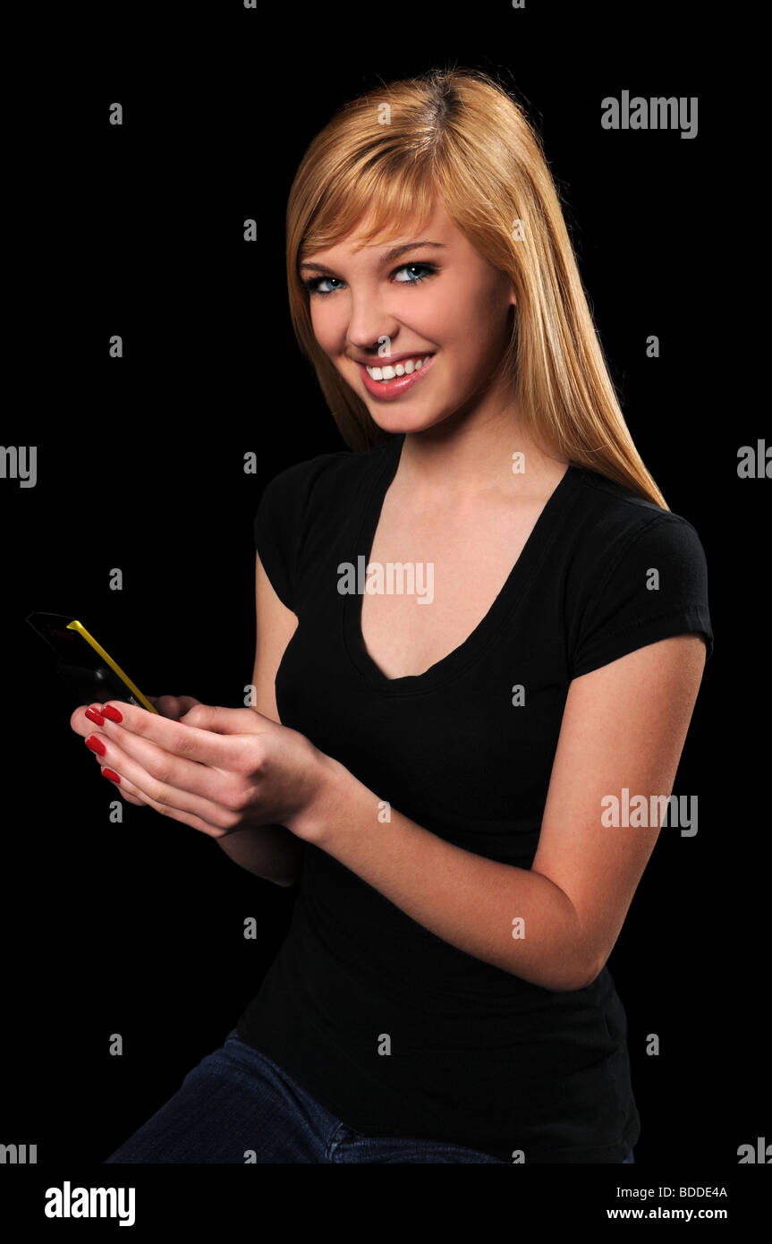 Beautiful teenager using cell phone to text message Stock Photo - Alamy