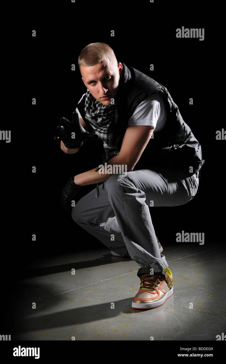 Portrait of hip hop dancer performing on the spotlight Stock Photo - Alamy