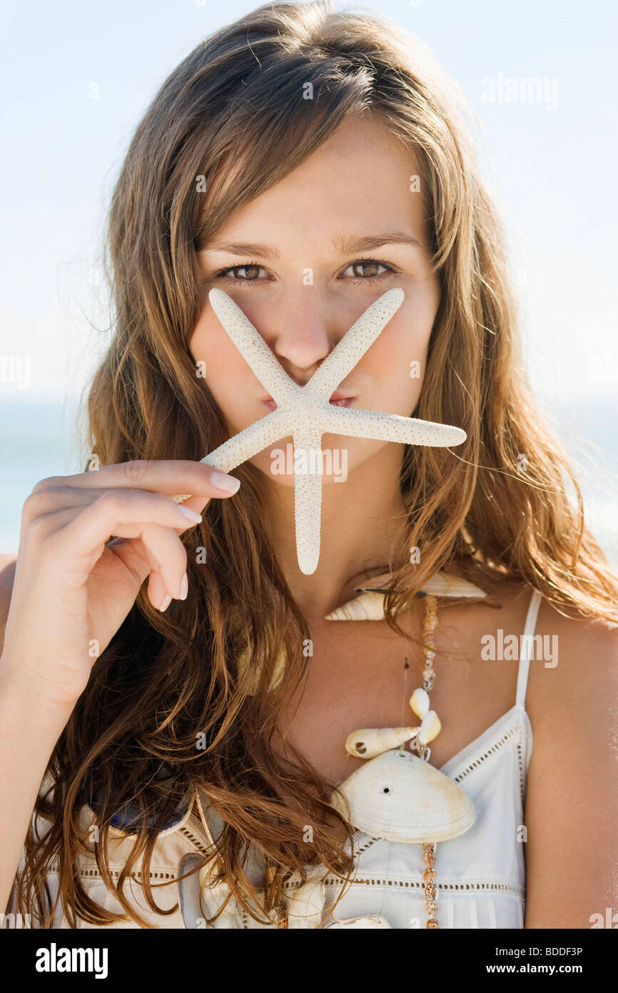 Portrait of a woman kissing a starfish Stock Photo - Alamy