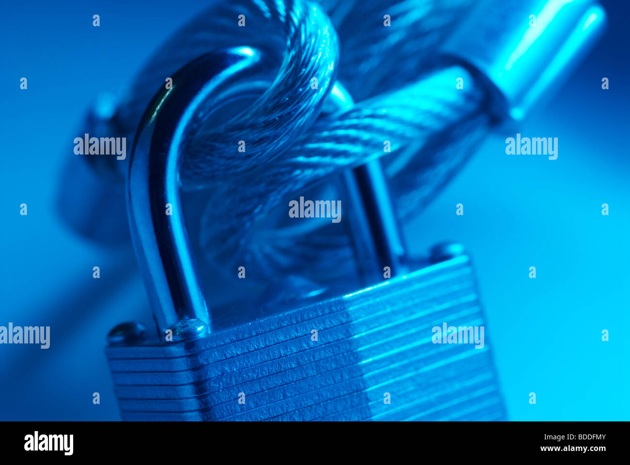 Padlock locking a steel cable Stock Photo - Alamy