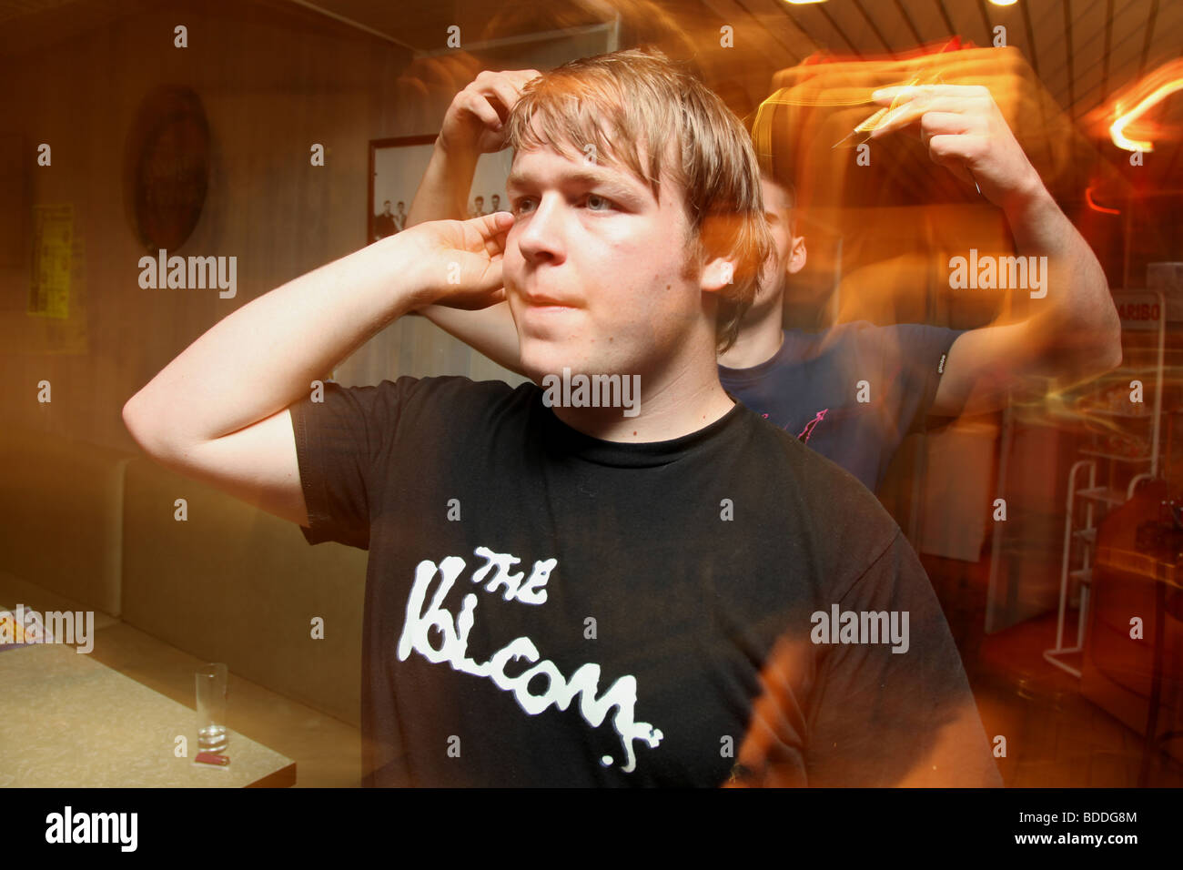 Man playing darts in a bar Stock Photo - Alamy