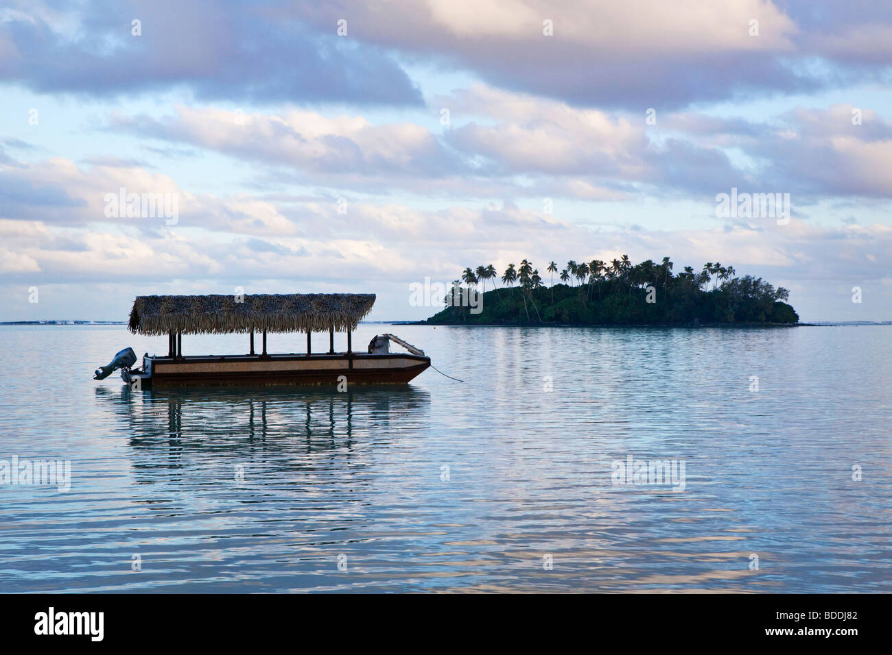 Tropical Island on the horizon as seen from Muri Beach on Rarotonga in ...