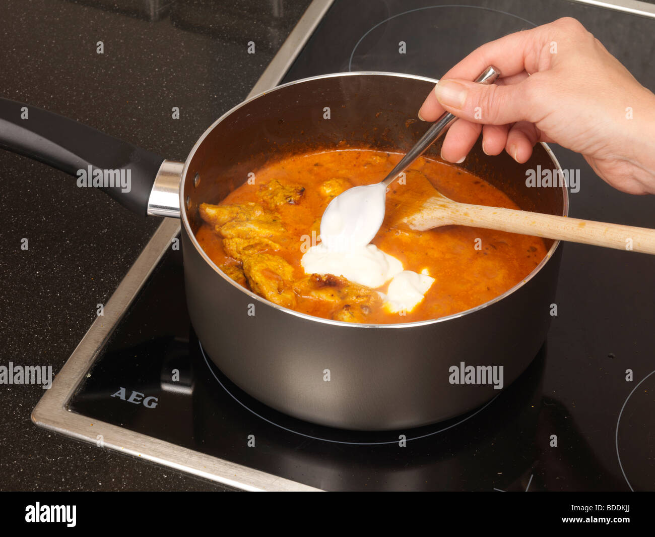 Shot 7 (Mixing Yogurt into Sauce Stock Photo - Alamy