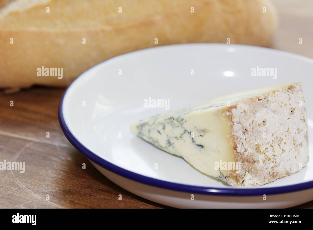 Lump of Stilton Cheese with a Bread Roll Stock Photo - Alamy